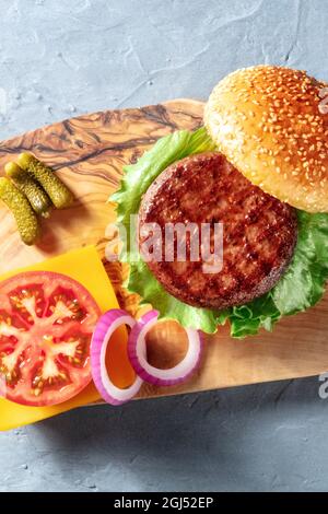 Cheeseburger ingredients, top view. Overhead, from above, flat lay ...