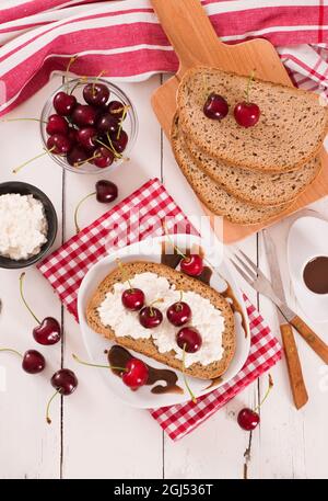 Rye bread with cottage cheese and cherries Stock Photo - Alamy