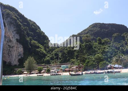 Boating near tropical islands waves and splashes Stock Photo - Alamy