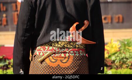 Men wearing traditional Javanese attire with keris Stock Photo - Alamy