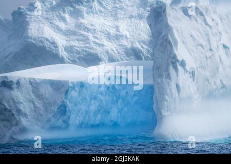 Antarctica, South Georgia Island, Coopers Bay. Iceberg with arch at sunrise Credit as: Don Grall ...