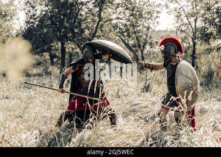Battle with spear and sword between two ancient greek or roman warriors ...