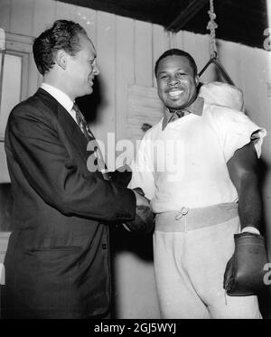Archie Moore, a boxing champion, and Jackie Robinson, a baseball legend ...