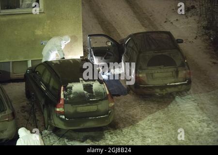 STOCKHOLM 20140123 Police forensic team is seen working at the scene of ...