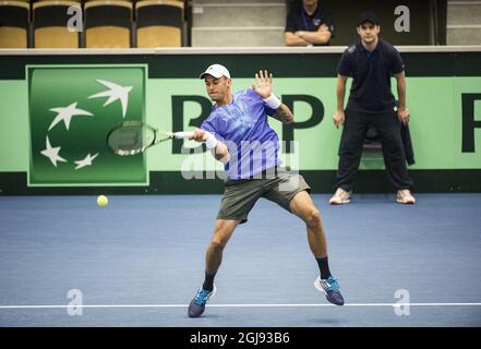 AustriaÂ’s Andreas Haider Maurer returns the ball in his singles match ...