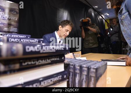 STOCKHOLM 20150827 Swedish writer David Lagercrantz is seen signing ...