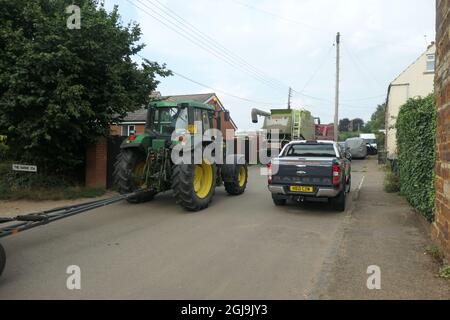 Moving farm machinery in Ringstead Northamptonshire Village UK Stock ...