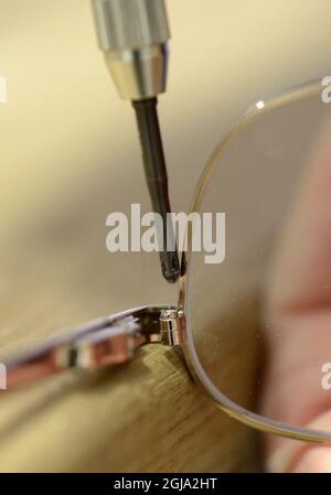 STOCKHOLM 20160404 optometrist,optician, pliers, glass, glasses ...