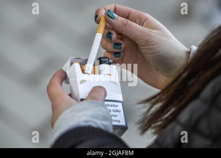 STOCKHOLM 20161206 cigarette, tobacco, smoker, nicotine, woman teenager ...
