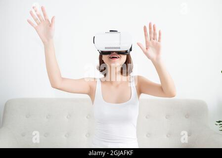 Smile happy woman getting experience using VR-headset glasses of ...