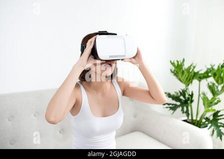 Smile happy woman getting experience using VR-headset glasses of ...
