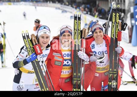 Ebba Andersson, of Sweden, and Heidi Weng, of Norway, right, compete in ...