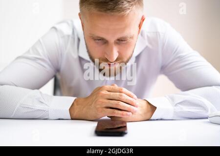 Man Waiting Phone Call At Office Desk Stock Photo - Alamy