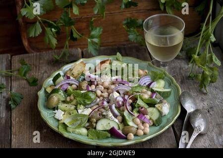 Chickpea salad with croutons, avocado, red onion, olives and feta ...