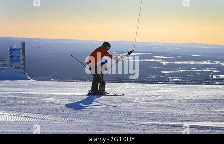 People skiing in Fjatervalen ski resort in Dalarna, Sweden. Photo ...