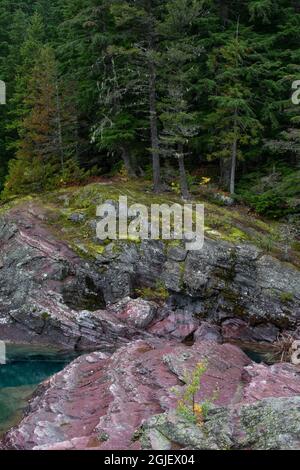 USA, Montana. Rocky outcrop, McDonald Creek, Glacier National Park ...