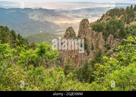 USA, New Mexico. Sandia Mountains and cottonwood trees in early spring ...