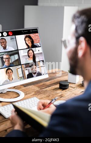 Male caucasian student having a video call with male teacher on laptop ...