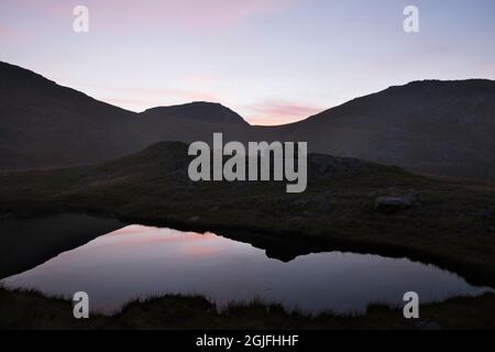 Esk Hause seen from a tarn on Tongue Head, in the English Lake District ...