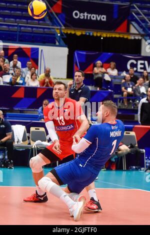 Jan Galabov, left, of the Czech Republic hits the ball against Tunisia ...