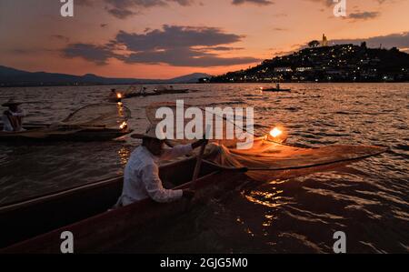 Indigenous Mexican Purepecha fisherman using traditional butterfly nets ...