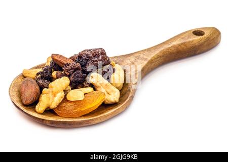 Nuts, raisins and apricots on rustic wooden background. Concept for ...