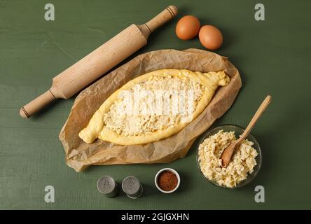 Uncooked Georgian khachapuri - A bread bowl filled with cheese resting ...
