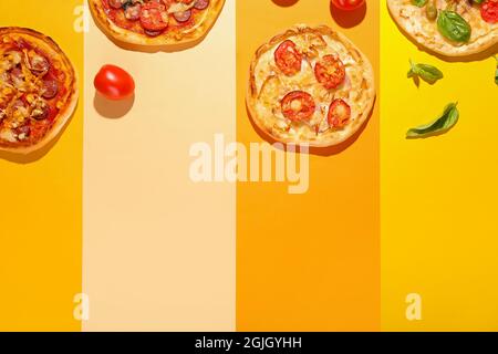 Tasty mini pizzas on color background Stock Photo - Alamy