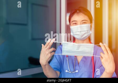 Nurse wearing mask and face shield Stock Photo - Alamy