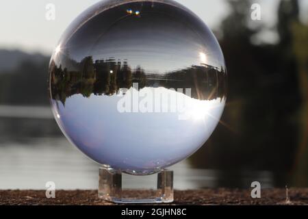 a beautiful landscape photographed through a lens ball Stock Photo - Alamy