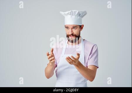 male chef in uniform walkie-talkie professional restaurant light background Stock Photo - Alamy
