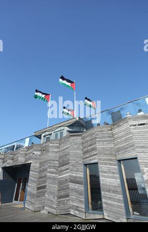 Palestinian flags flying on Hastings pier during 'Palestine on the Pier ...