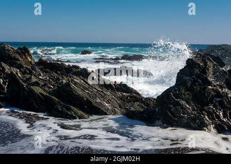 Closeup shot of sea waves beautifully touching the rocks Stock Photo ...
