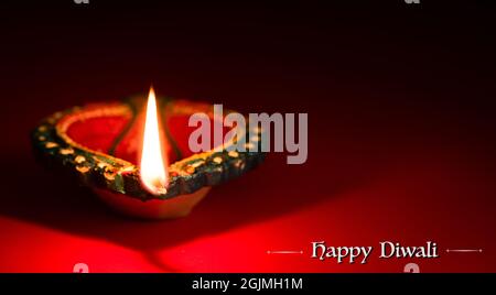 Happy Diwali, Clay Diya lamps lit during Diwali, Hindu festival of ...