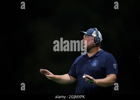 Oree's head coach Xavier De Greve looks on during a hockey game between ...