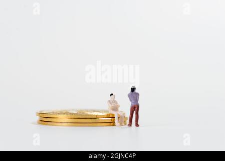 Human figure sitting on a crypto currency and talking with a another ...