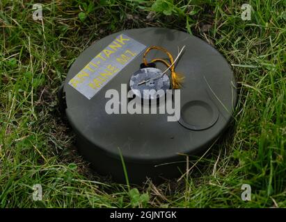 An anti-tank mine (abbreviated to "AT mine") is a type of land mine ...