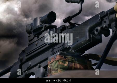 Modern military machine gun tripod mounted on mobile platform, aiming ...