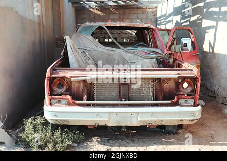 Crashed car of red color. Side view of the wrecked vehicle. The car ...