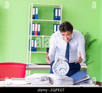 Frustrated businessman stressed from excessive work Stock Photo - Alamy
