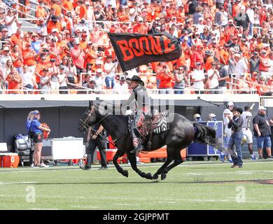 The Oklahoma State spirit rider and Bullet ride across the field ...