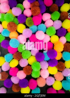 small kids craft pom poms background image Stock Photo - Alamy