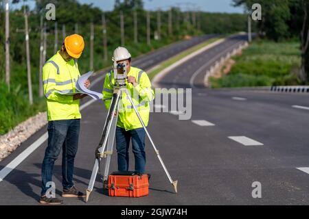 A Civil Engineers checking the expressway on road construction Stock ...