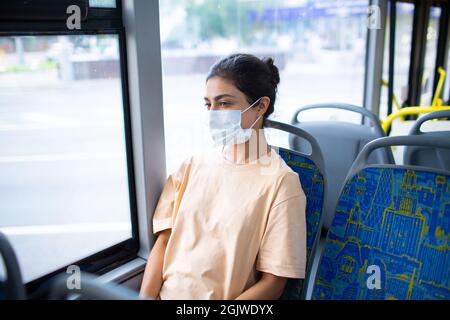 Indian female with a mask in the city on a sunny day Stock Photo - Alamy