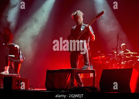 Eugene Abdukhanov of Jinjer band plays a bass guitar live on stage at ...