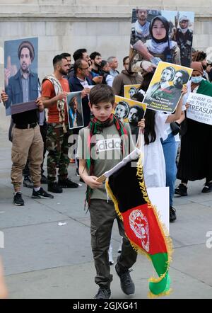 12th Sept, 2021. London, UK. A masked demonstrator makes a peace sign ...