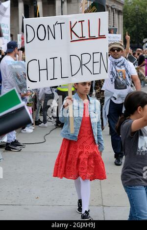 12th Sept, 2021. London, UK. A masked demonstrator holds a Palestinian ...