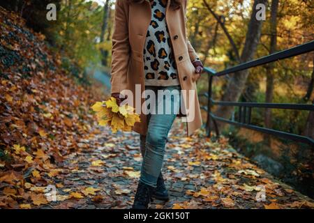 Hello october. Closeup on woman in scarf with leather gloves and yellow ...