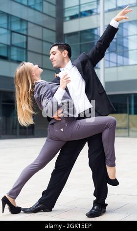 Dancing, employee and man with colleagues, happiness and celebration ...