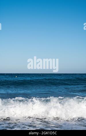 White sea foam. Windy day. Blue Aegean sea in Greece. Scenic seascape ...